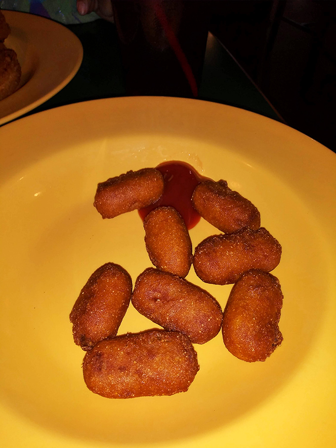Golden-brown tater tots with a side of dipping sauce&mdash;proof that sometimes the simplest pleasures are the most satisfying.