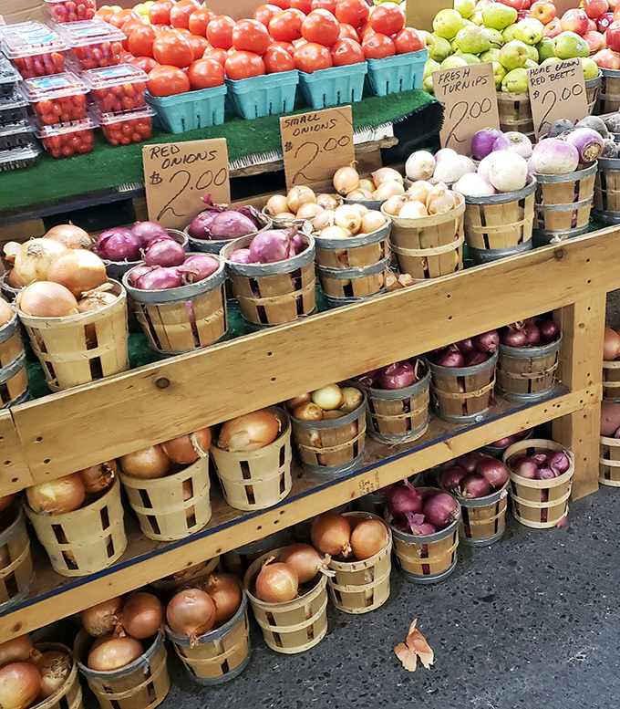 Farm-fresh onions stacked like edible architecture prove that beauty comes in practical packages.