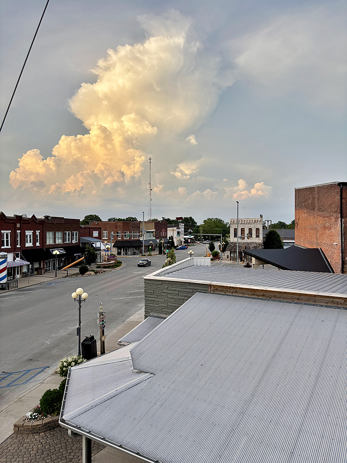 Casey's charming downtown unfolds beneath dramatic clouds, showcasing the small town with big ideas that brought these oversized attractions to life.