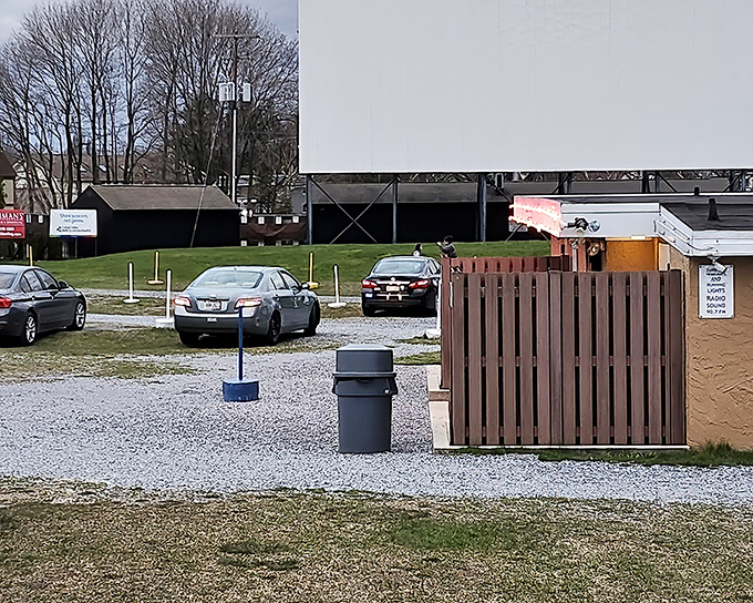 The viewing screen awaits dusk, when pixels replace emptiness and movie magic transforms an ordinary field.