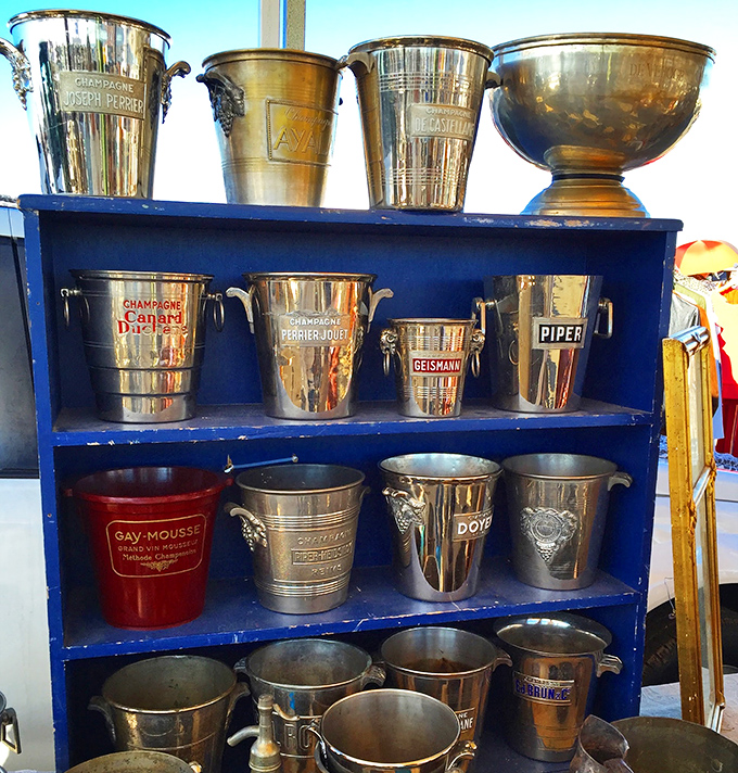 Champagne buckets with pedigree! These gleaming vessels once chilled bubbly for celebrations long past, now awaiting your next toast.