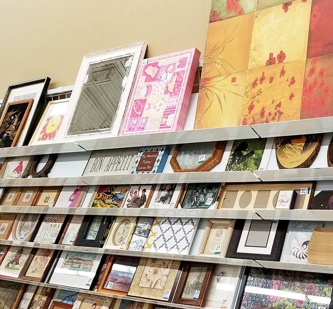 Wall art and frames waiting for their second act. Someone's discarded decor becomes your conversation piece with just a little imagination.