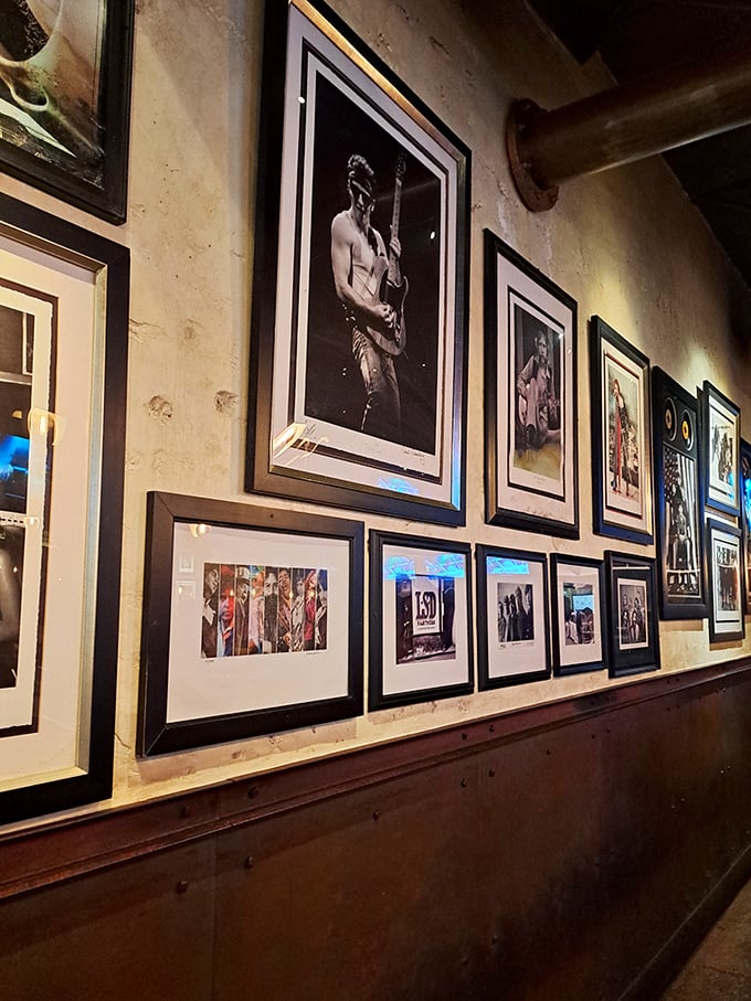 Wall art that tells you this place takes its music as seriously as its menu&mdash;a visual playlist spanning decades of rock history.