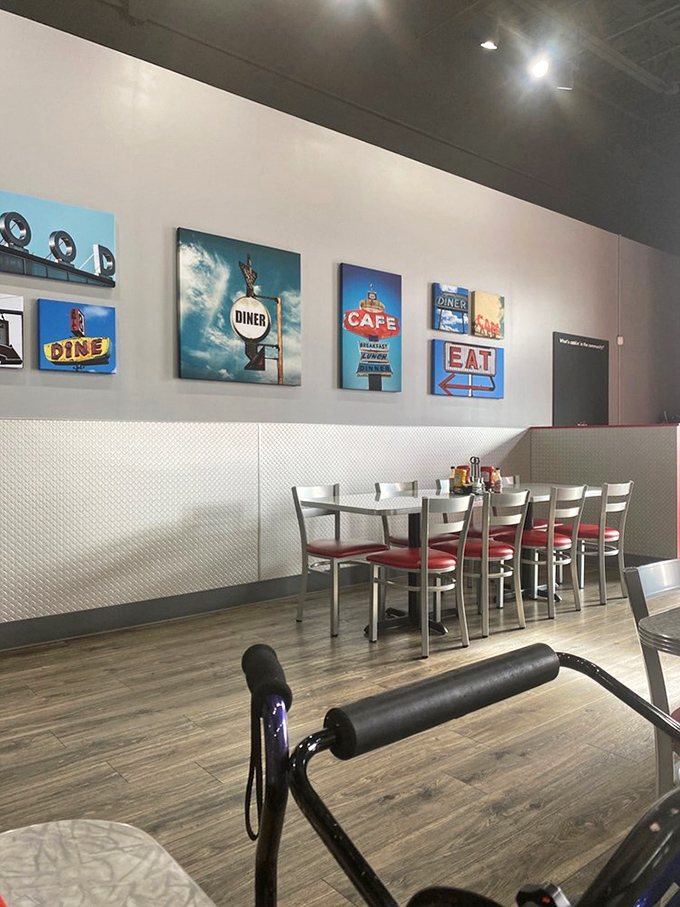 Diner-themed artwork that doesn't just decorate walls&mdash;it tells you exactly what you're in for: classic American comfort without the irony.