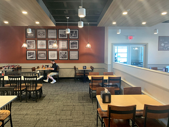 Warm wood tones and framed historical touches on the walls create a surprisingly cozy atmosphere that elevates the entire all-you-can-eat experience considerably.