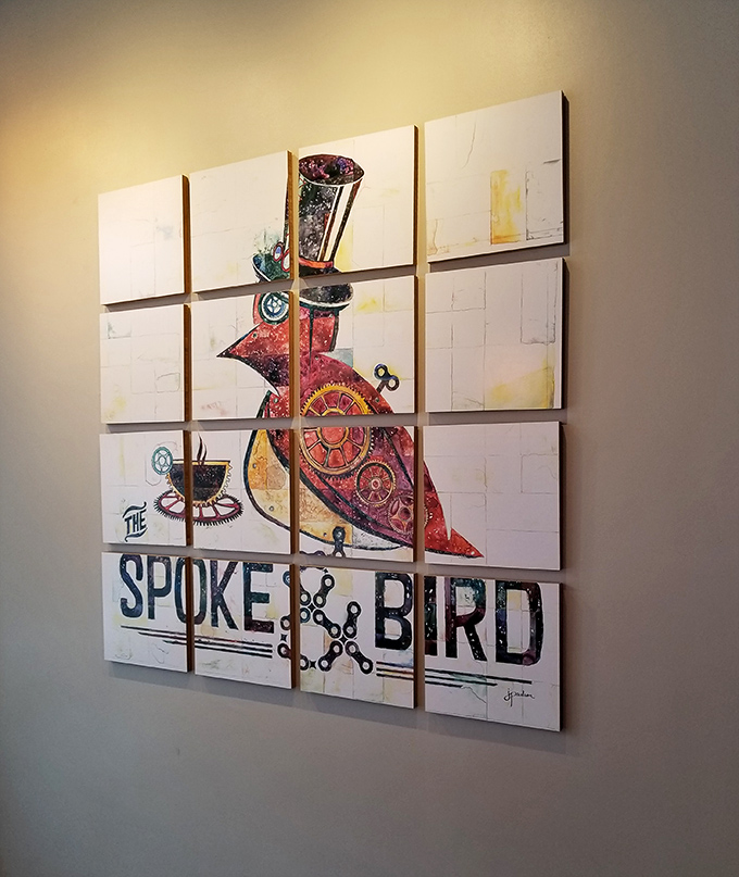 Wall art that tells a story&mdash;the restaurant's steampunk-inspired bird mascot watches over diners like a dapper, mechanical guardian of good taste.