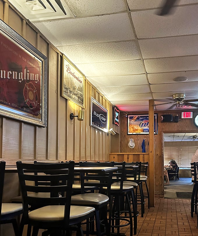 Beer signs and wood paneling create that classic "third place" atmosphere where everybody might actually know your name.