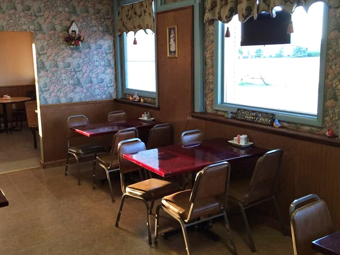 Floral wallpaper and practical tables create dining spaces where families have celebrated birthdays, first dates, and Tuesday night dinners for years.