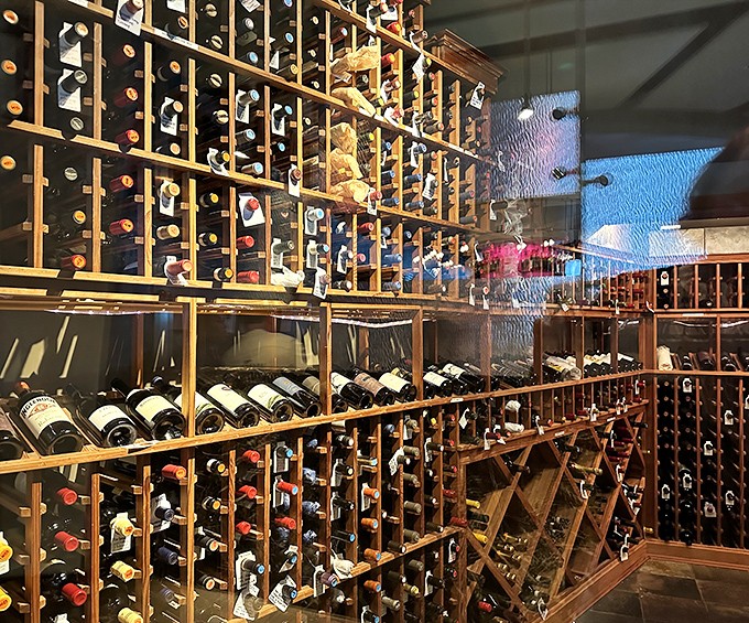 This wine cellar doesn't just store bottles&mdash;it houses liquid time capsules waiting to complement your seafood feast. Wooden racks cradle vintages like precious artifacts.