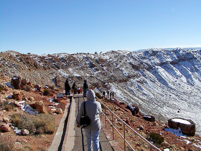 Winter transforms the crater into a snow-dusted cosmic bowl&mdash;proof that even asteroid impacts look better with a touch of frost.