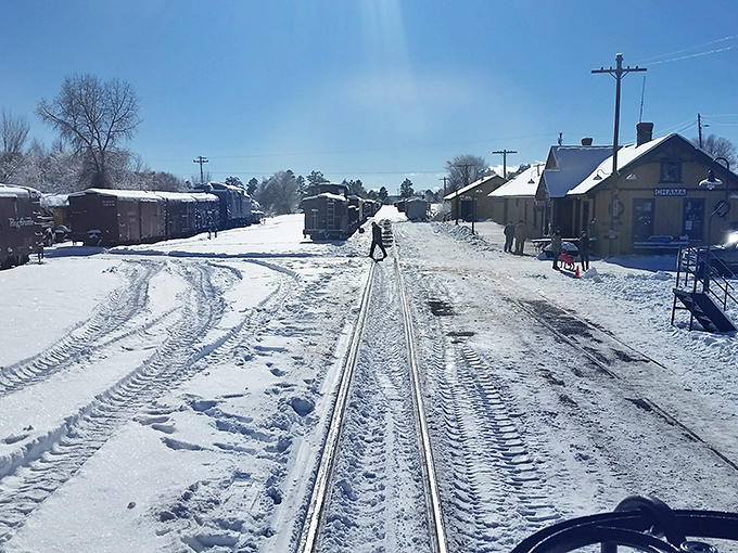 Winter transforms the railroad into a real-life snow globe where footprints tell stories and every breath becomes visible poetry. 