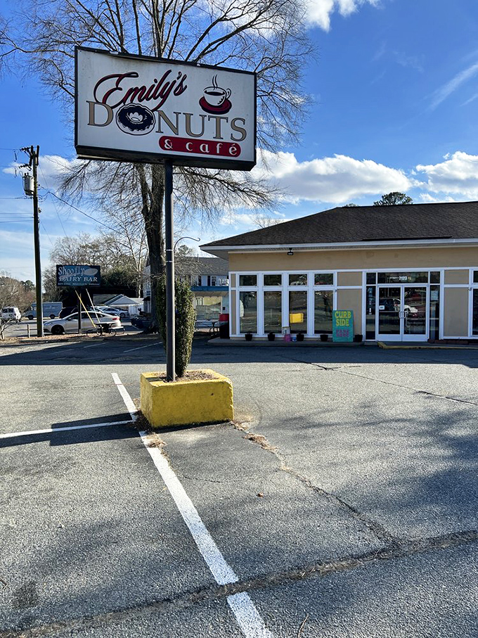 Emily's classic sign stands tall like a lighthouse guiding hungry sailors to donut shores. A Williamsburg landmark!