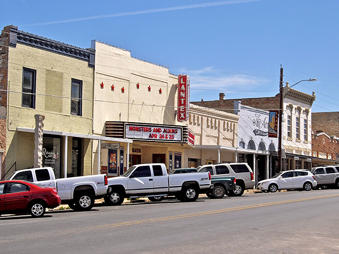 Llano's theatres glow with bright sunny colors, the historic buildings creating a perfect small-town charm against the clear Texas sky.