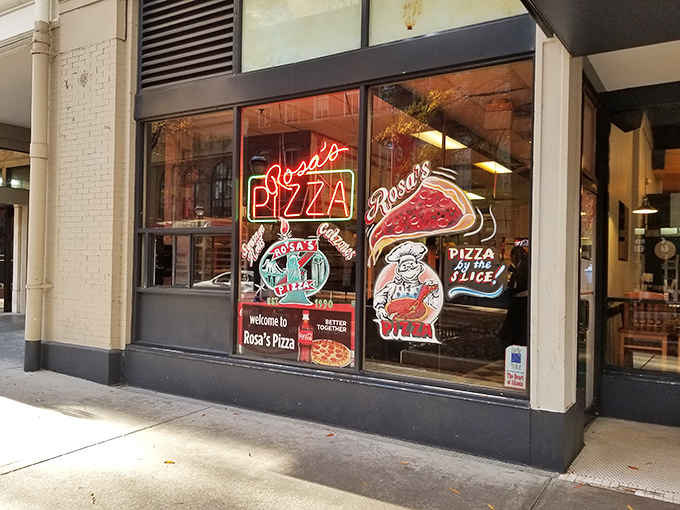 Classic neon signs and downtown energy - Rosa's keeps New York pizza tradition alive. 