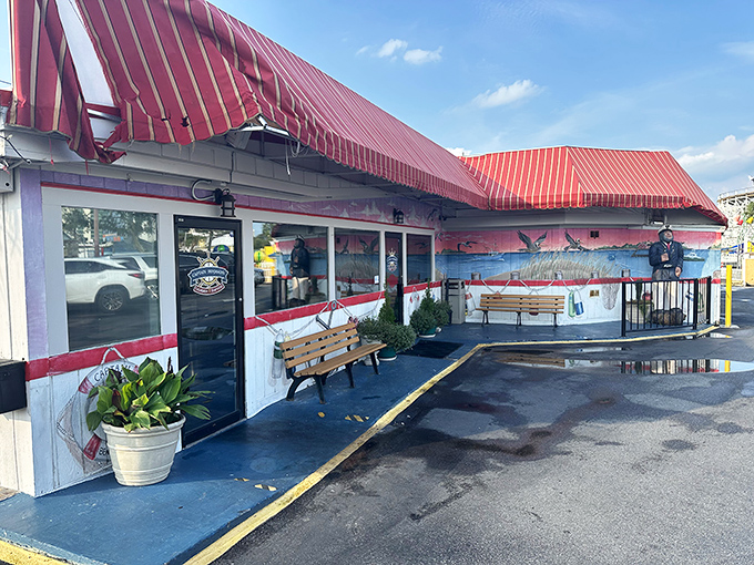 Coastal murals and welcoming benches hint at the all-you-can-eat seafood paradise waiting just inside those doors.