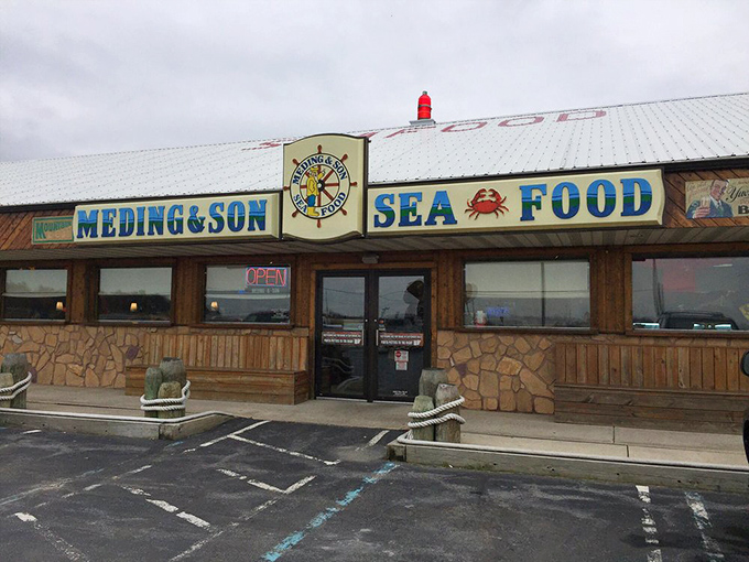 The nautical-themed sign with its ship's wheel promises seafood with maritime heritage and flavor.