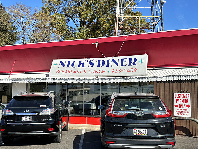 The vintage vibe of Nick's Diner, with its classic signage and newspaper boxes, is a throwback to simpler times.