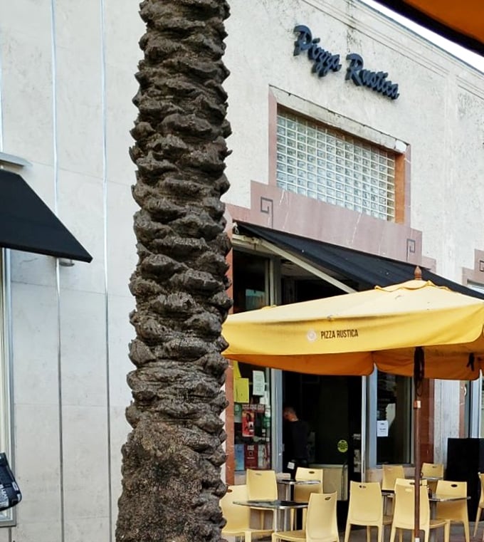 Yellow umbrellas and outdoor seating make Pizza Rustica the perfect Lincoln Road pit stop. Pizza watching the people watching you!