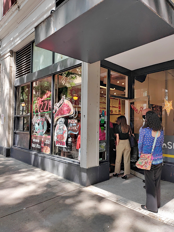 That welcoming storefront promises the kind of authentic pizza that makes downtown Atlanta delicious. 