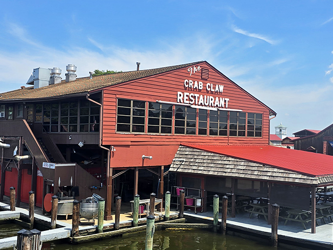 The red siding of The Crab Claw stands out against St. Michaels' harbor. A beacon of seafood excellence since 1965.