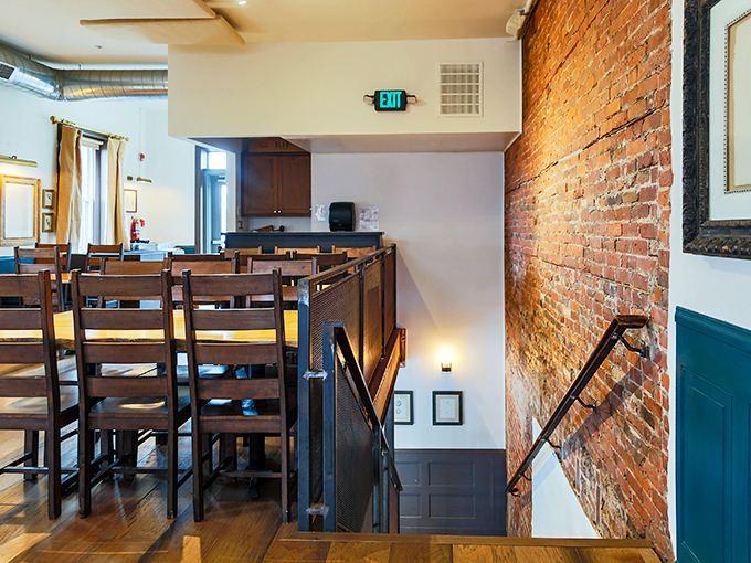 The second floor offers both elevation and perspective&mdash;wooden chairs waiting patiently for the next round of culinary conversations.