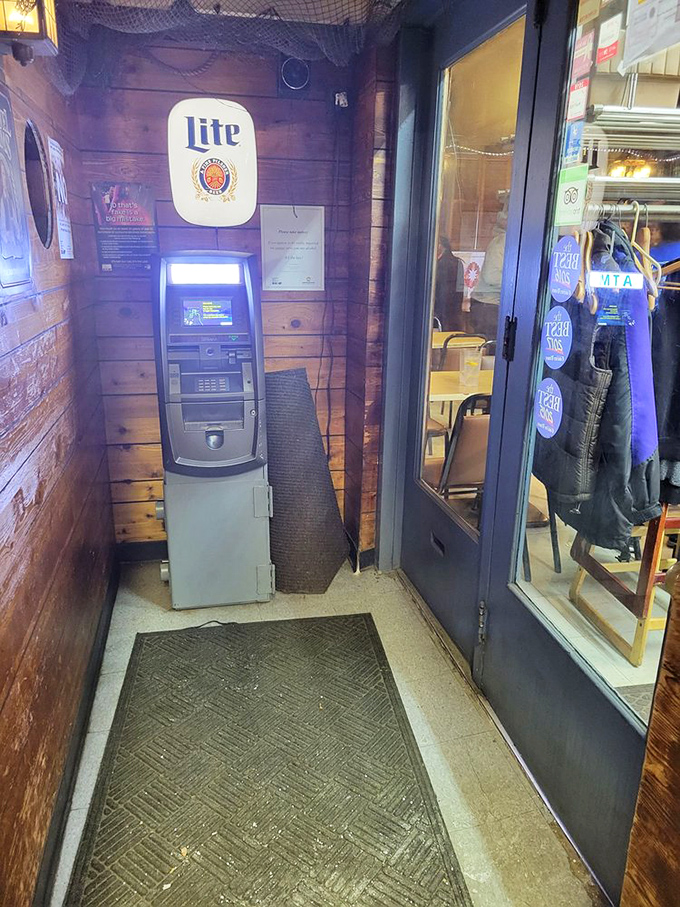 Even the ATM gets the nautical treatment, nestled against wood-paneled walls that make you feel like you're in a ship's galley rather than a suburban restaurant.