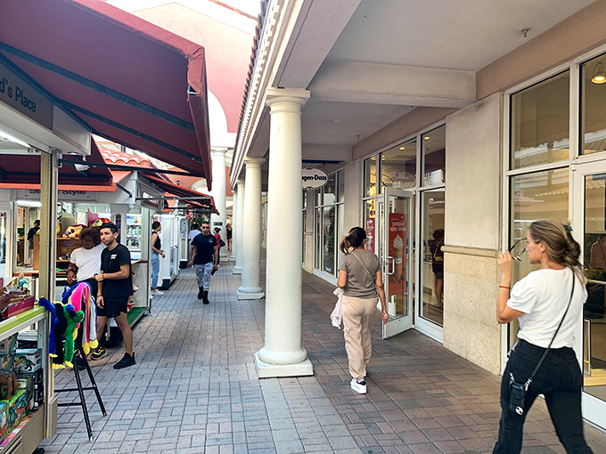 The covered walkways of Premium Outlets provide merciful shade while shoppers debate between "need" and "want."