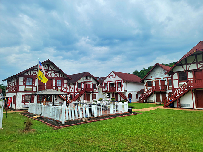 Alpine Village Inn sprawls across manicured lawns, looking like a Bavarian postcard escaped into three-dimensional Georgian reality.