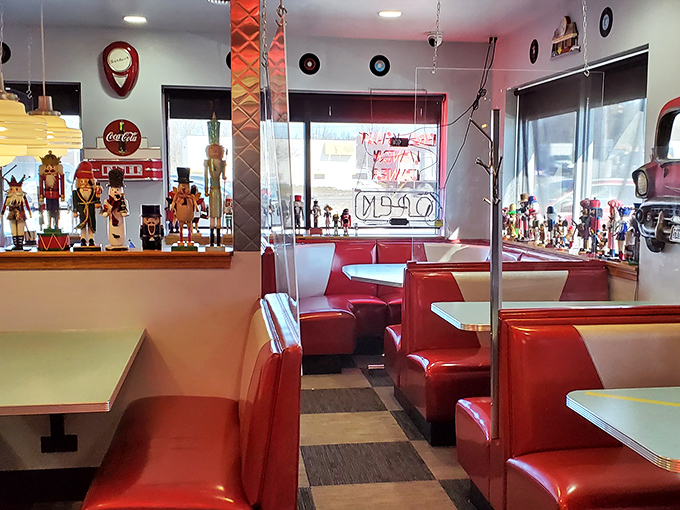 Classic diner booths in fire-engine red aren't just seating&mdash;they're community gathering spots where conversations flow as freely as the coffee.