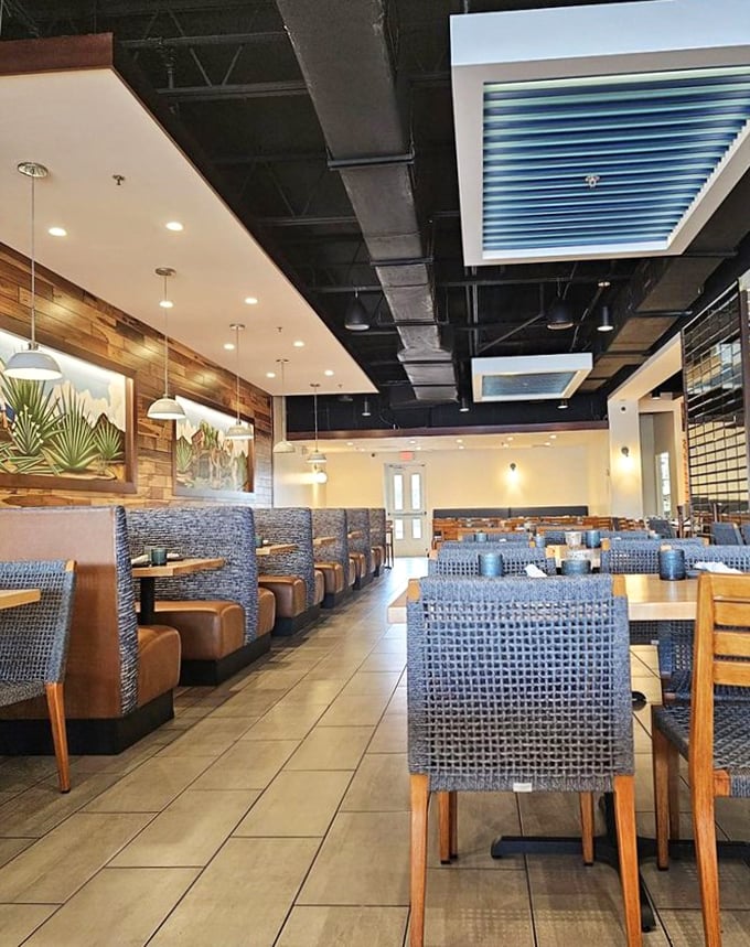 Blue chairs and warm wood tables create a contemporary dining space that's as comfortable for quick lunches as it is for lingering dinner conversations.