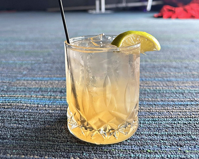 A perfectly balanced cocktail that catches light like a liquid prism—proof that The Avenue takes their drinks as seriously as their noodles.