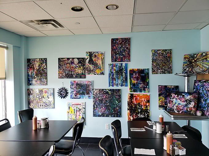 Who knew breakfast came with a side of art gallery? These vibrant paintings give your eyes something to feast on while waiting for your food.