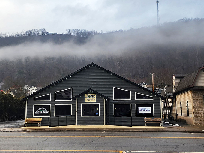 The Artisan Center emerges from morning mist like a mountain secret, promising handcrafted treasures within its unassuming exterior.