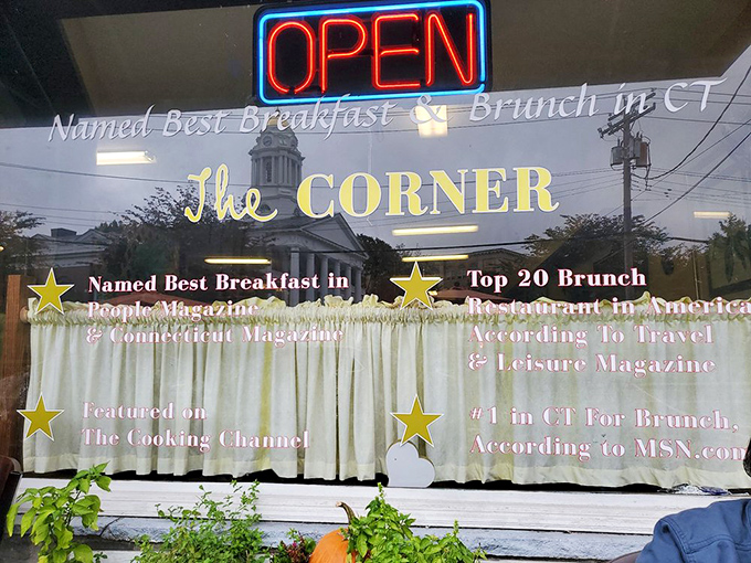 Awards and accolades line the window like proud parents showing off their honor student's achievements.