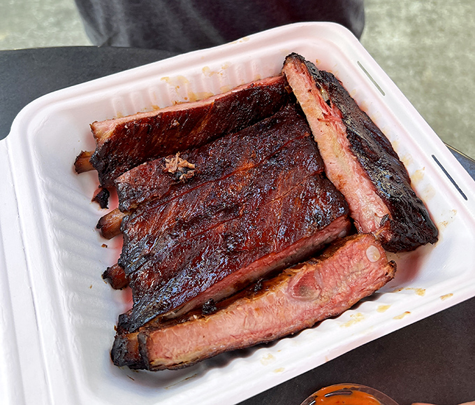 Ribs with that perfect pink smoke ring&mdash;visual evidence of the time-honored tradition of patience. The kind of food that makes conversation impossible except for appreciative grunts.