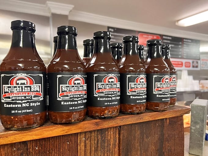 Bottles of that legendary vinegar-pepper sauce lined up like soldiers ready for deployment. One taste and you'll understand why it's worth bottling.