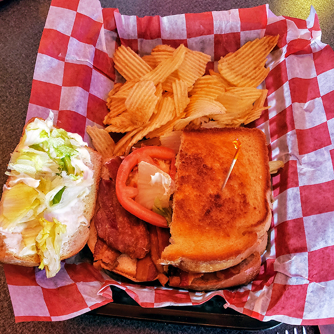This isn't just a sandwich; it's architecture. Perfectly toasted bread, crisp lettuce, and bacon that makes a compelling argument for pork as a food group.