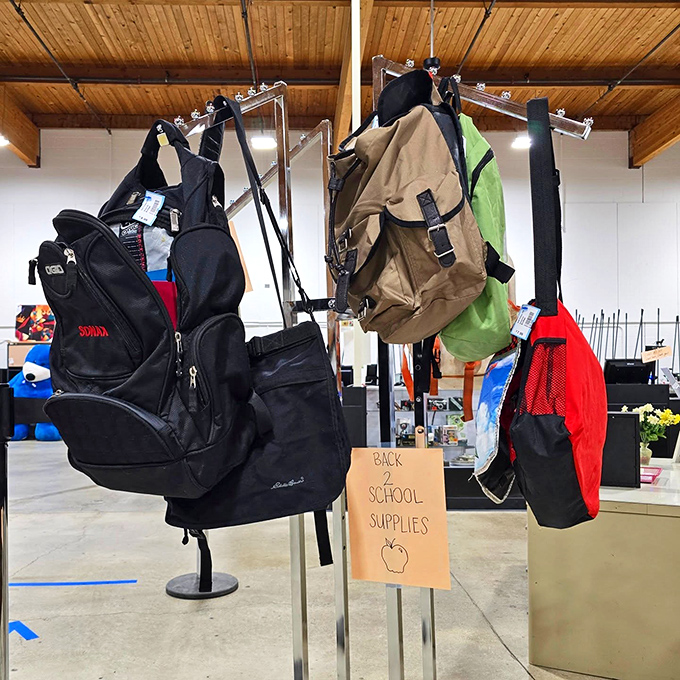 Backpacks of every size and color hang waiting, ready for school days, hiking trails, or spontaneous road trips.