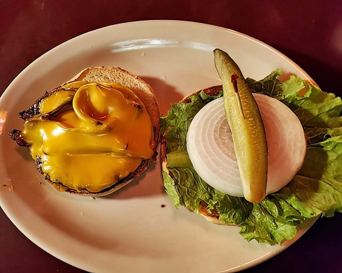 This cheeseburger isn't just topped&mdash;it's crowned with melted cheese cascading down the sides like a yellow waterfall of deliciousness.