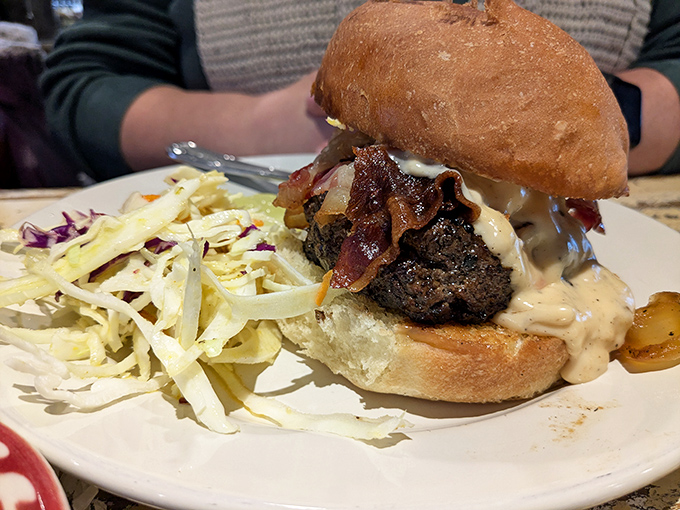 A burger that demands a two-handed commitment and plenty of napkins. The slaw on the side isn't an afterthought &ndash; it's the perfect counterpoint.