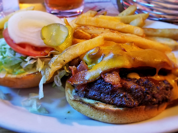 A burger that's dressed better than most people on a Friday night&mdash;layers of melty cheese, bacon, and fresh veggies creating the perfect bite.