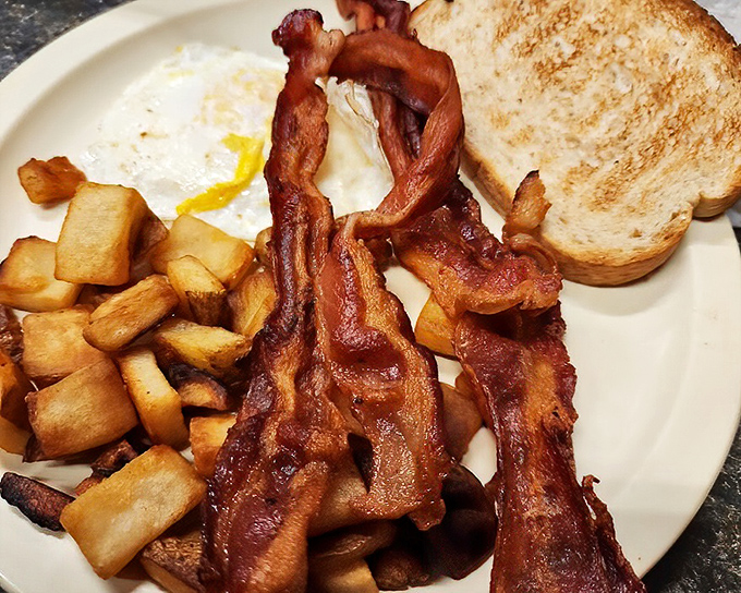 Bacon that's achieved that perfect balance between crisp and chewy. The kind that makes you wonder if you should order a side of just bacon next time.