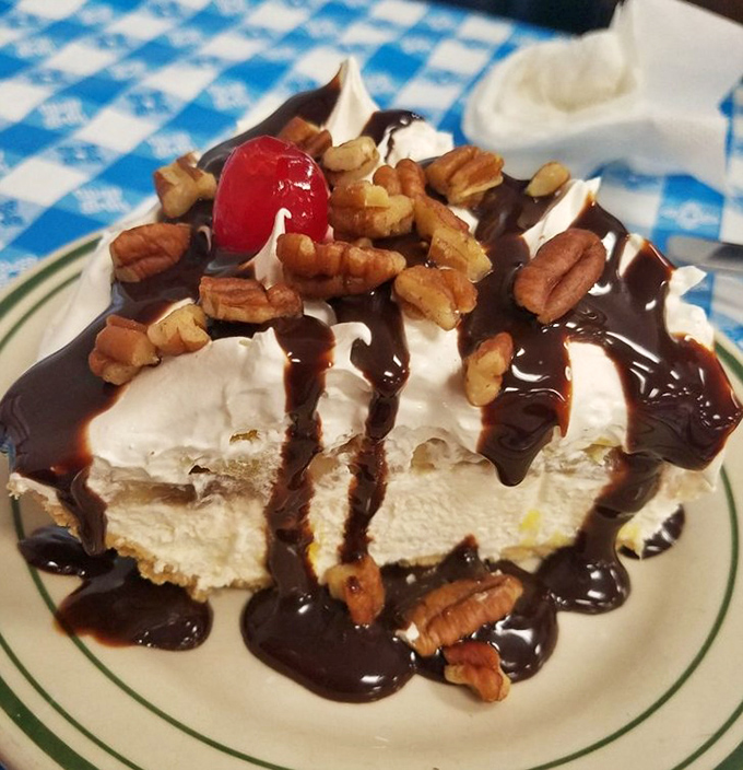 This isn't just pie &ndash; it's a monument to excess done right, with pecans standing guard over chocolate and cream.