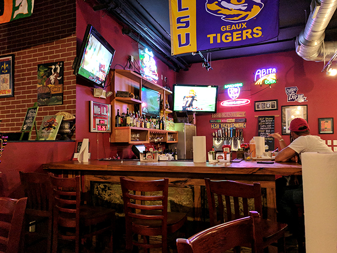 The bar area where LSU Tigers flags hang proudly and cold drinks flow as freely as football conversations.