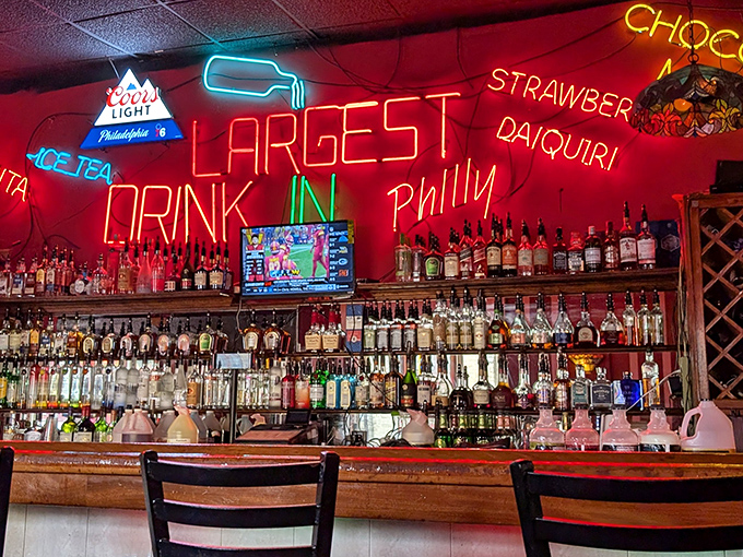LARGEST DRINK IN PHILLY the neon promises, in a bar that understands sometimes you need something substantial to wash down greatness.