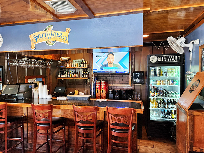 The bar area whispers "stay awhile" with craft beers on display&mdash;because great burgers deserve worthy liquid companions.