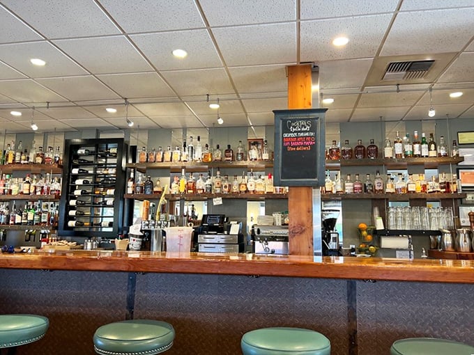 A bar stocked like a liquid library, where bottles of amber spirits stand ready to warm you from the inside out. Alaska's liquid sunshine.