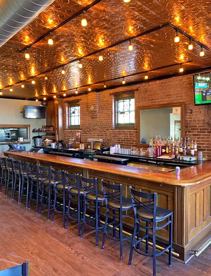 The bar where magic happens, under warm lights that make everyone look like they're in a food documentary's happy ending scene.