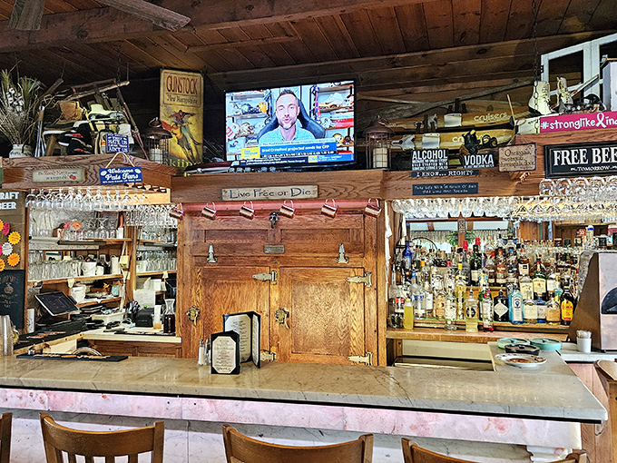 A bar stocked with enough spirits to raise yours, beneath wooden beams that have witnessed countless toasts to good times.