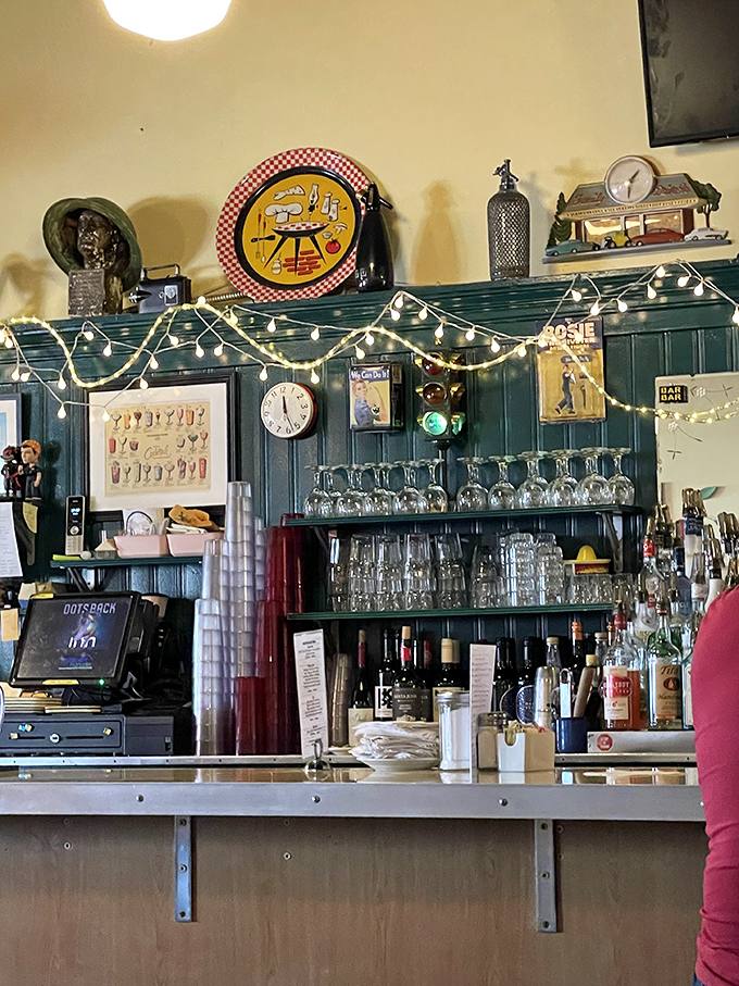 A bar that balances nostalgia with necessity. Vintage signs and twinkling lights create the perfect backdrop for everything from coffee to cocktails.
